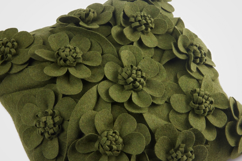 Cushion with flower embellishment