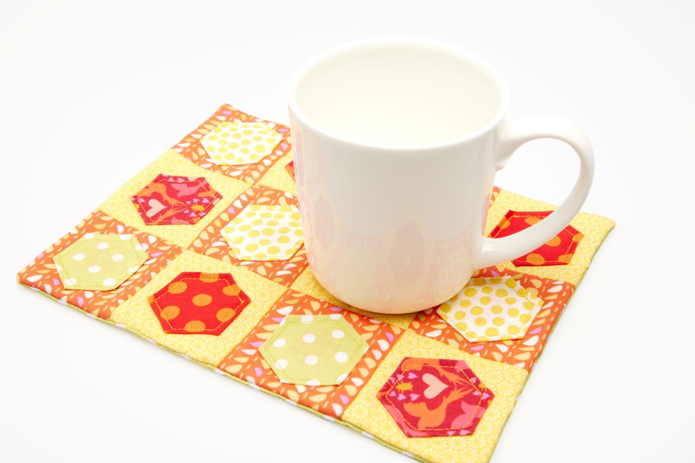 Mug rug with hexagon embellishments